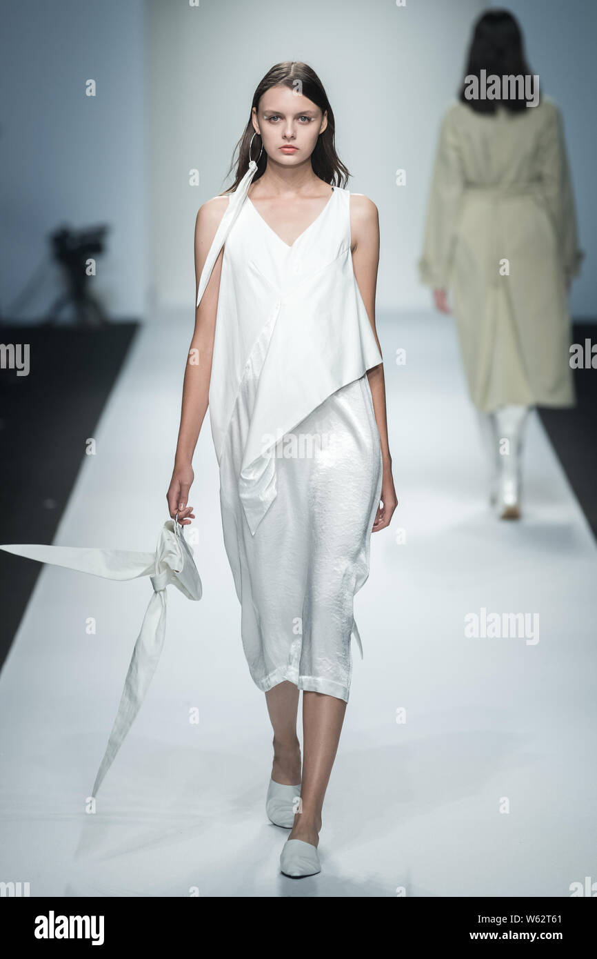 A model displays a new creation at the fashion show of Roderic Wong during the Shanghai Fashion ...