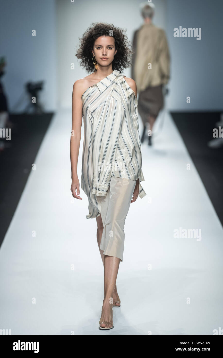 A model displays a new creation at the fashion show of Roderic Wong during the Shanghai Fashion ...