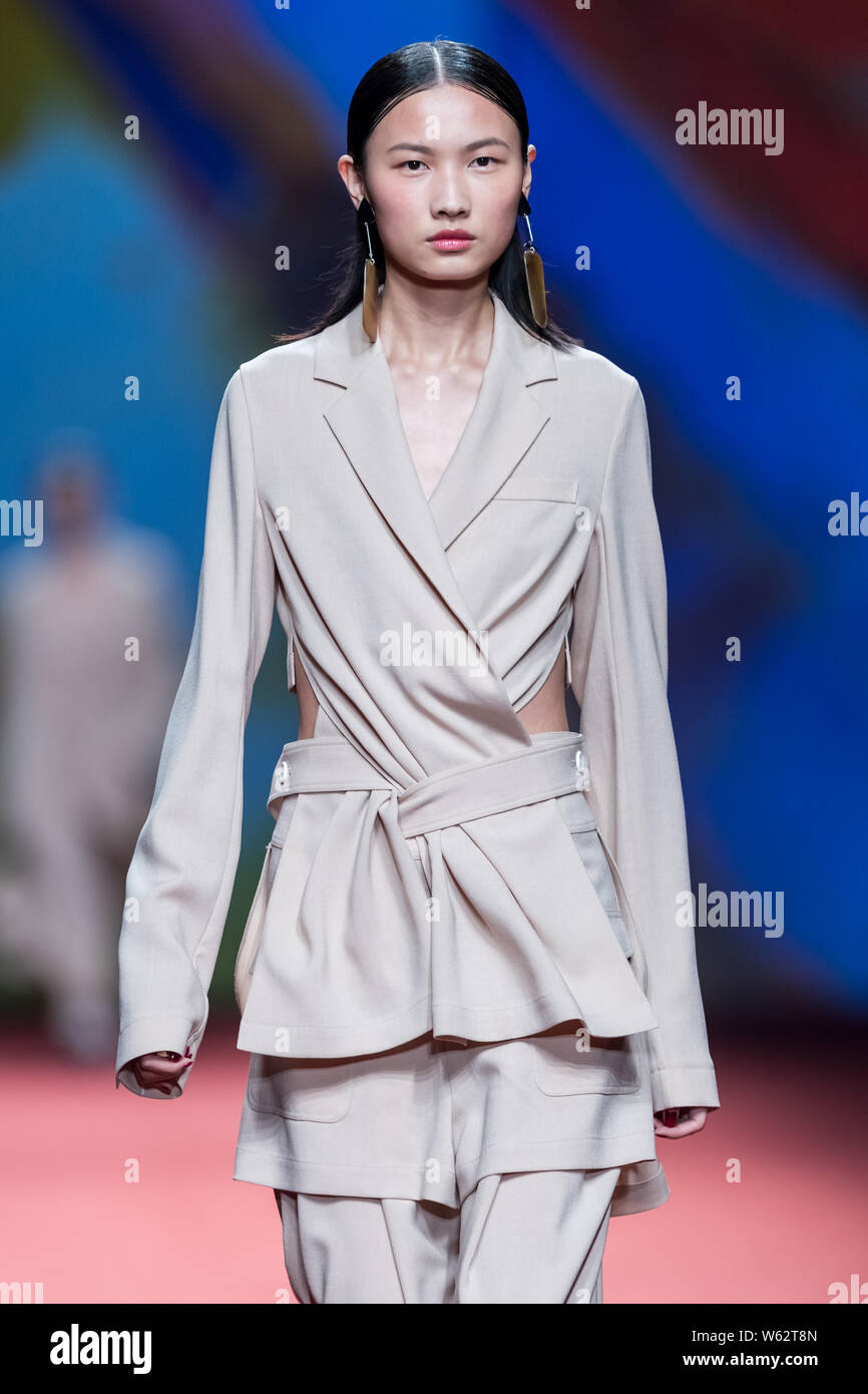 A model displays a new creation at the fashion show of Anirac during the Shanghai Fashion Week ...