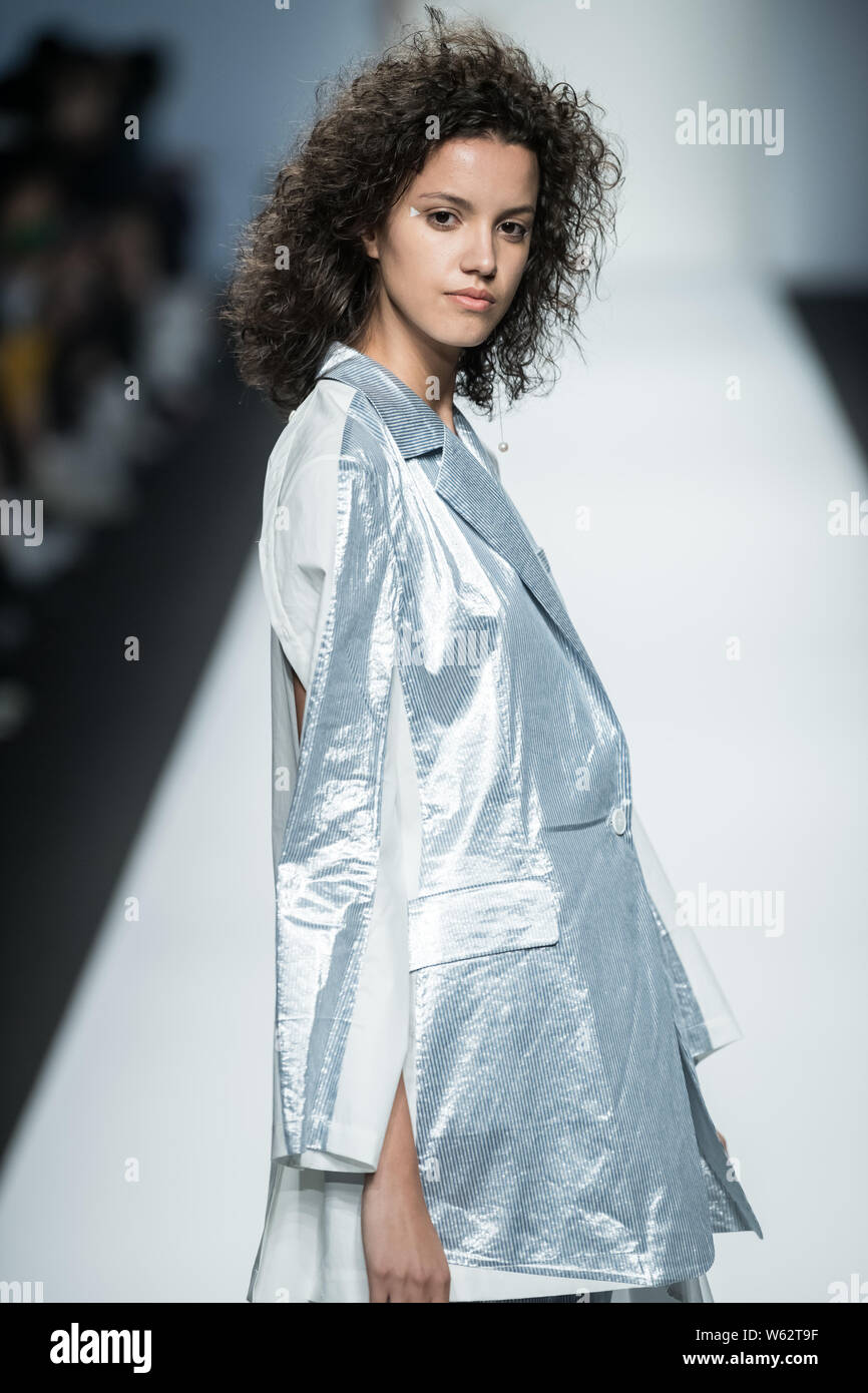 A model displays a new creation at the fashion show of Roderic Wong during the Shanghai Fashion ...