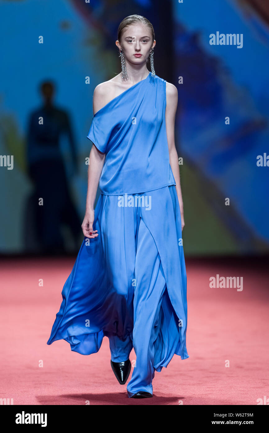 A model displays a new creation at the fashion show of Anirac during the Shanghai Fashion Week ...