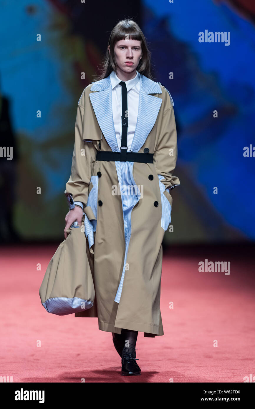 A model displays a new creation at the fashion show of Anirac during the Shanghai Fashion Week ...