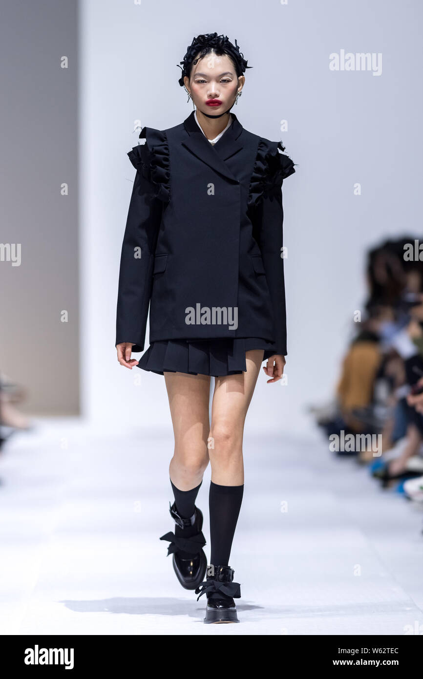 A model displays a new creation at the fashion show of Shushu/Tong ...