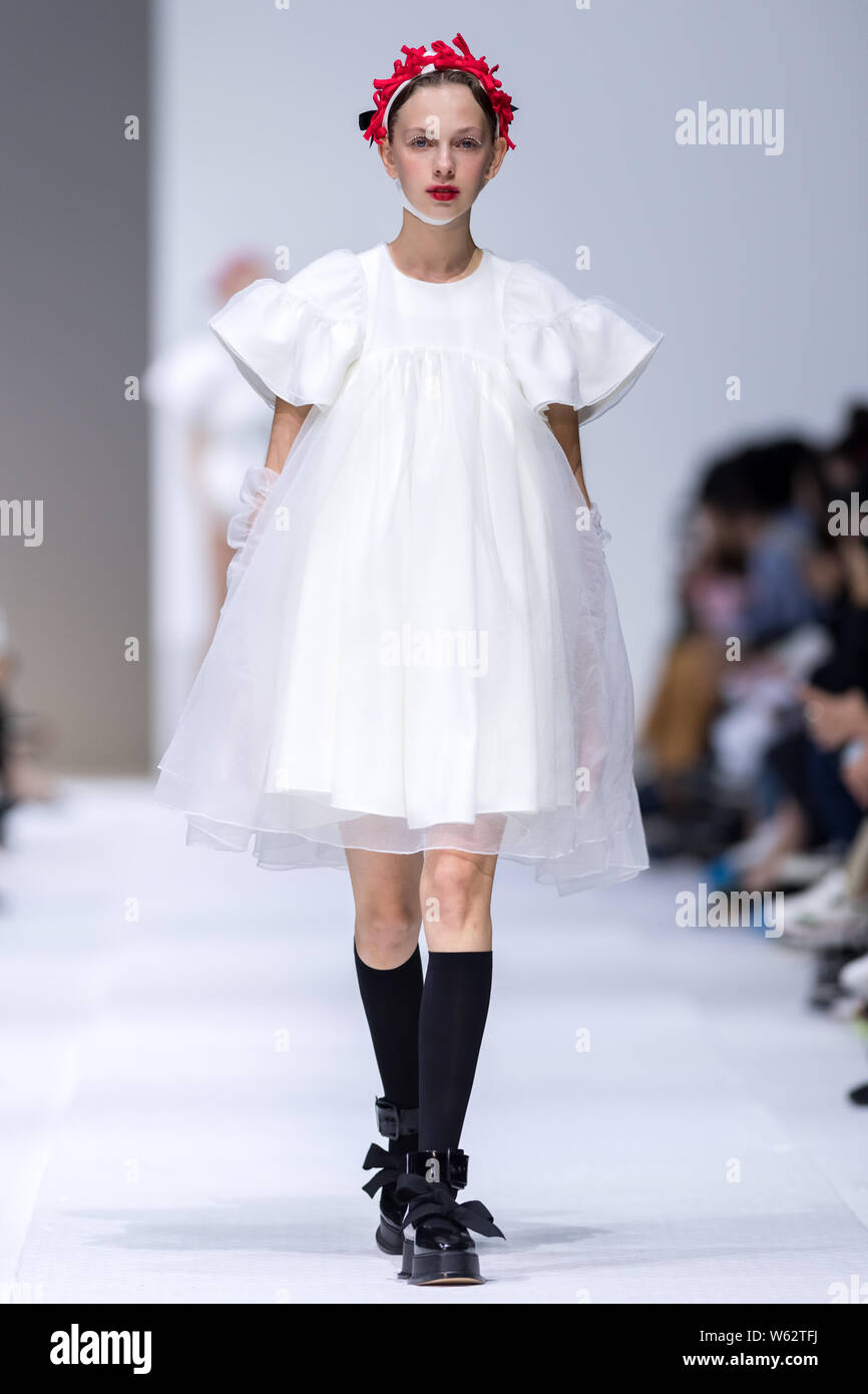 A model displays a new creation at the fashion show of Shushu/Tong ...