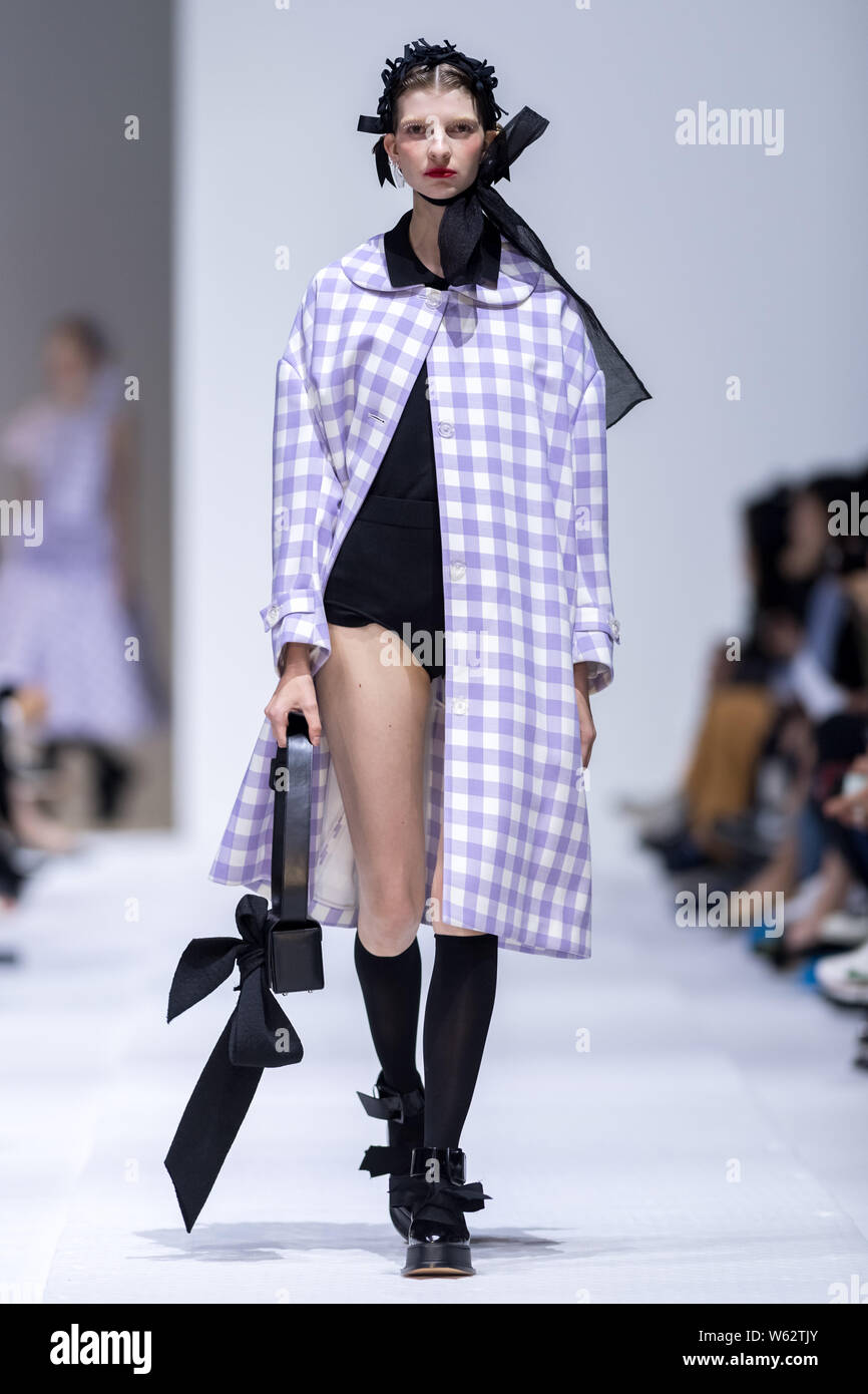 A model displays a new creation at the fashion show of Shushu/Tong ...