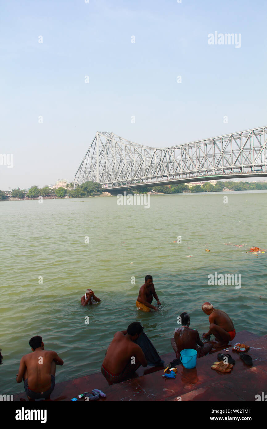 People bathing at a ghat, Howrah Bridge, Hooghly River, Kolkata, West ...
