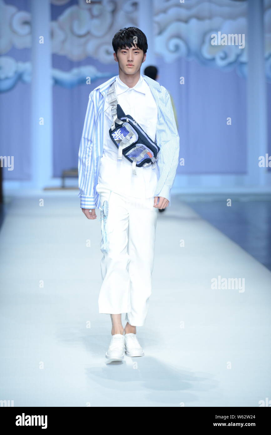 A model displays a new creation at the fashion show of SNOWWHITE by ...