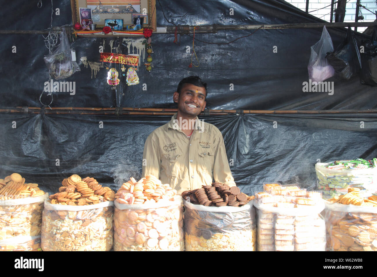 Shopkeeper selling cookies Stock Photo - Alamy