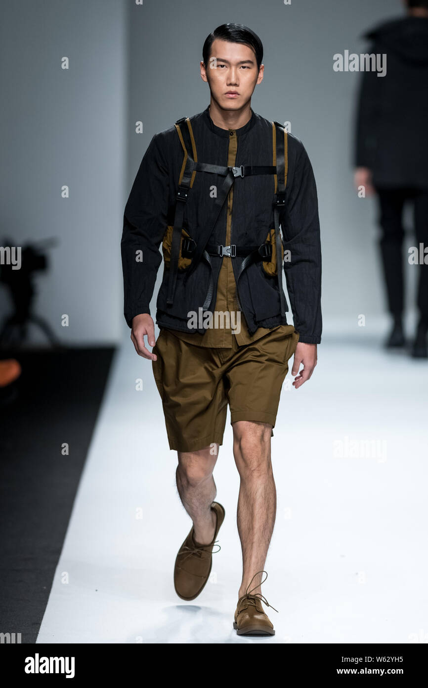 A model displays a new creation at the fashion show of Wu Zhi Wu during ...