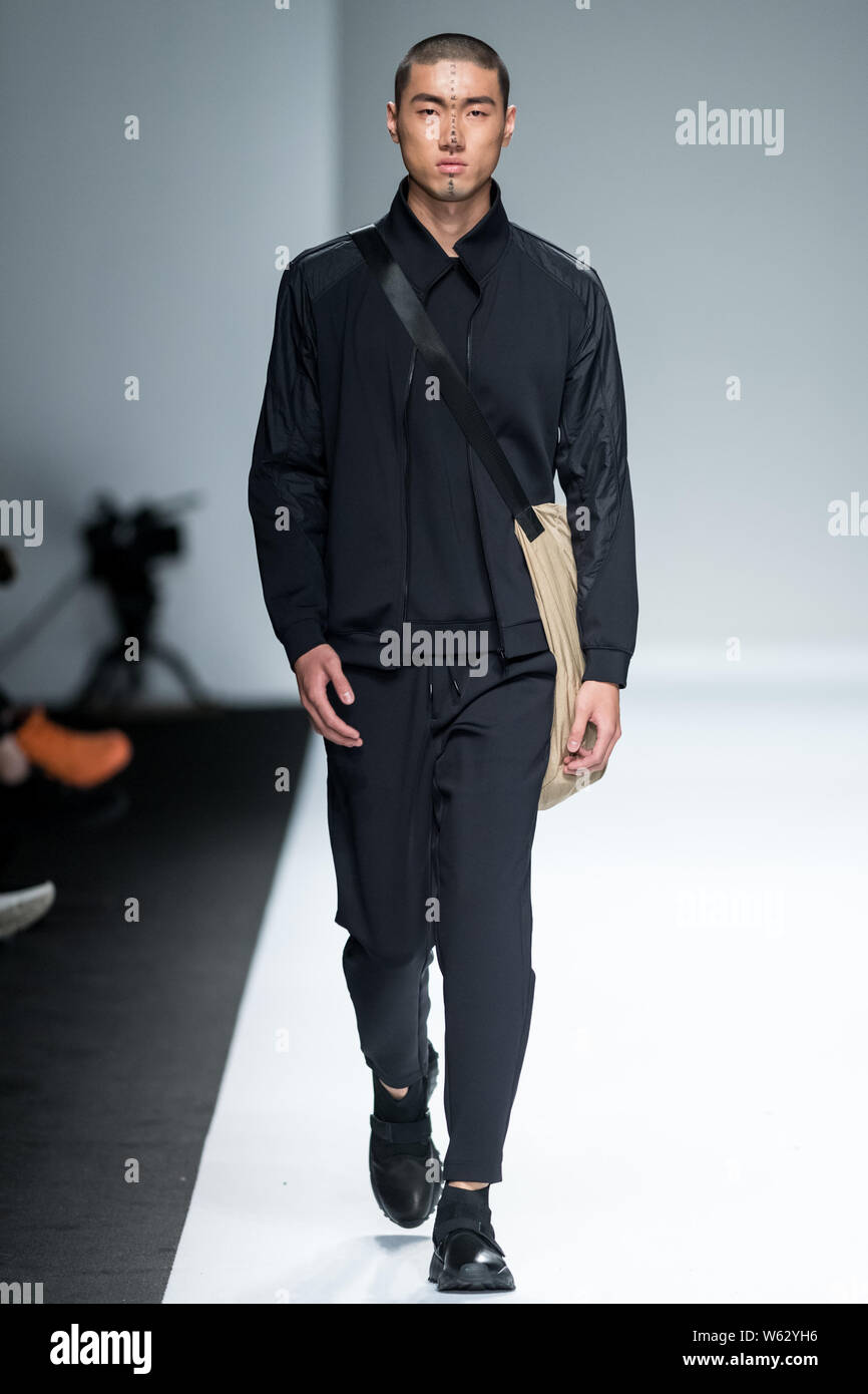A model displays a new creation at the fashion show of Wu Zhi Wu during ...