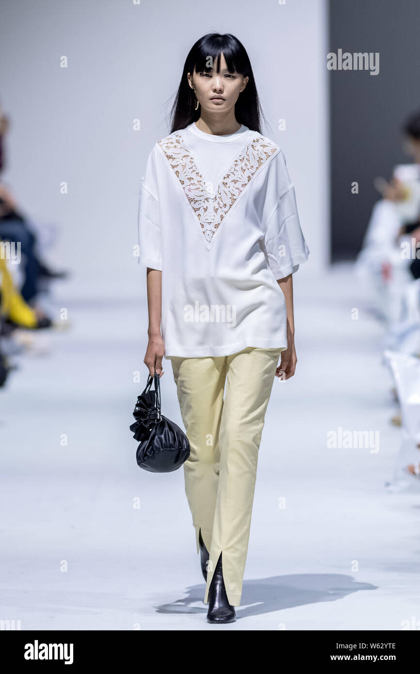 A model displays a new creation at the fashion show of IMMI during the ...