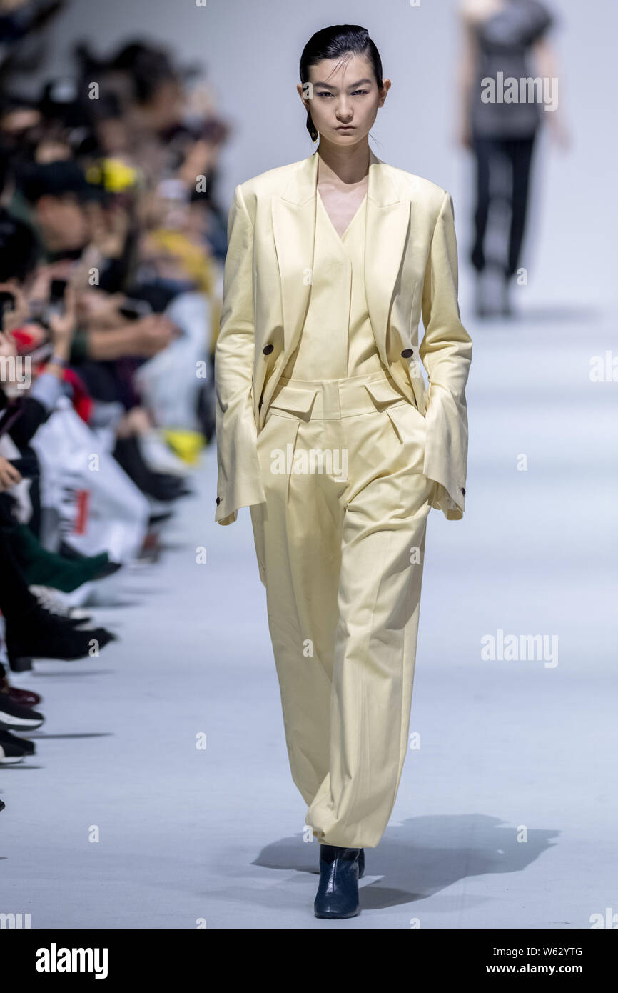 A model displays a new creation at the fashion show of IMMI during the ...