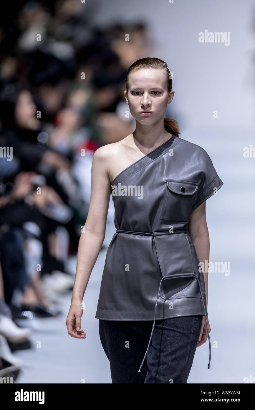 A model displays a new creation at the fashion show of IMMI during the ...