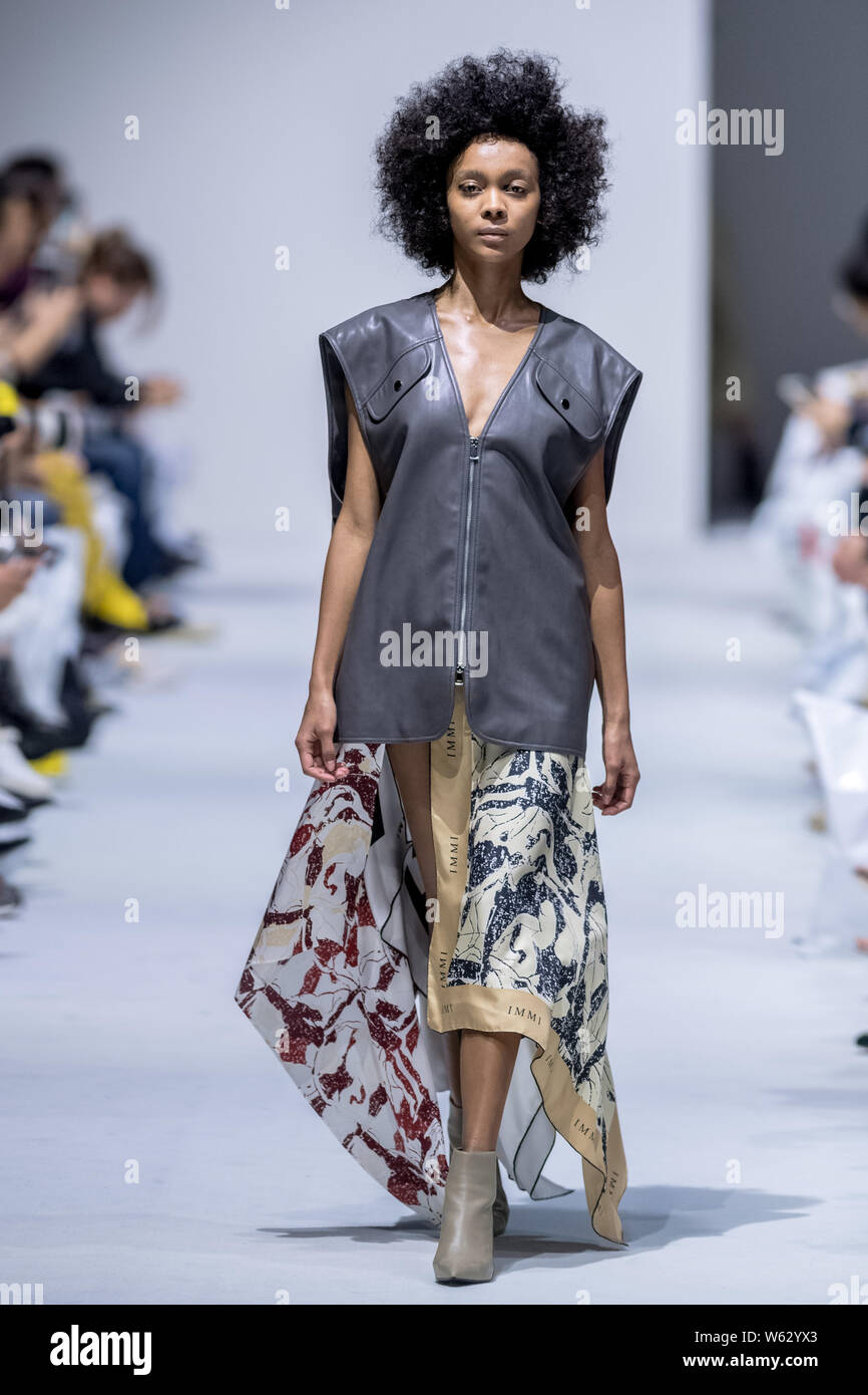 A model displays a new creation at the fashion show of IMMI during the ...