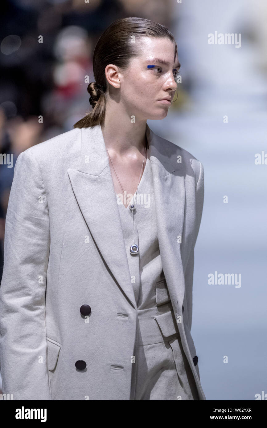 A model displays a new creation at the fashion show of IMMI during the ...