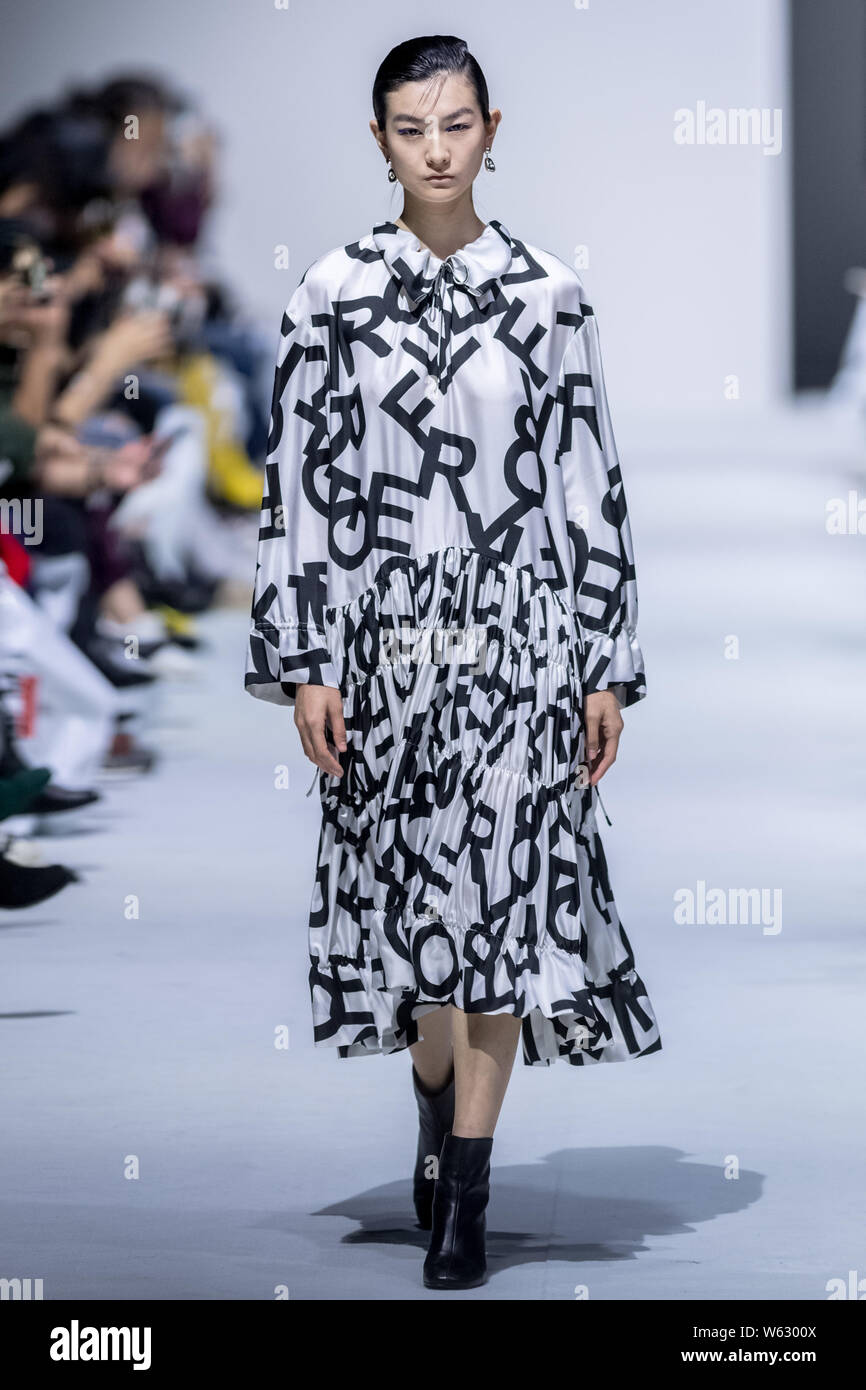 A model displays a new creation at the fashion show of IMMI during the ...