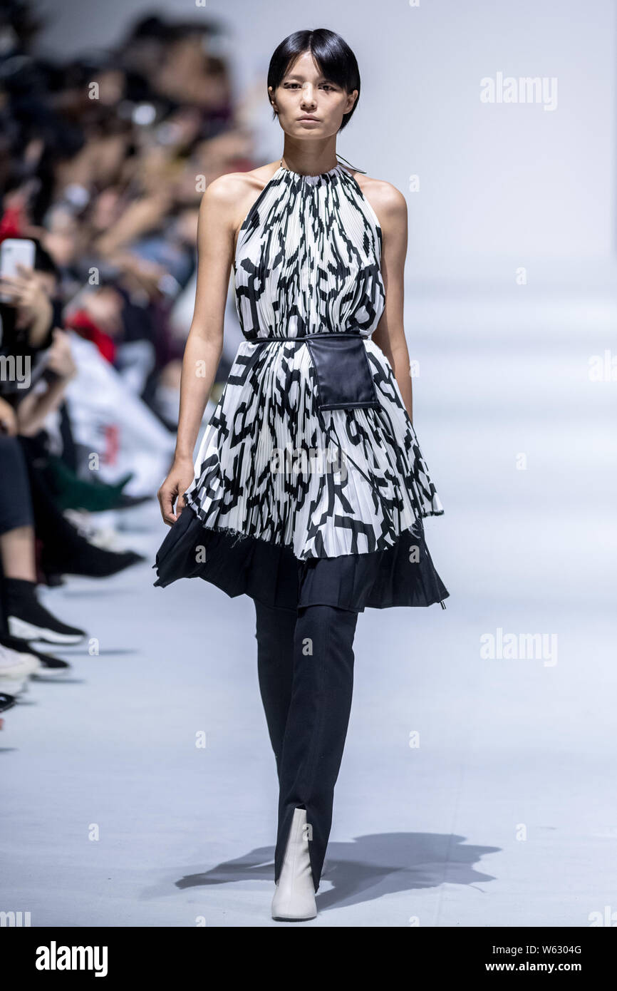 A model displays a new creation at the fashion show of IMMI during the Shanghai Fashion Week ...