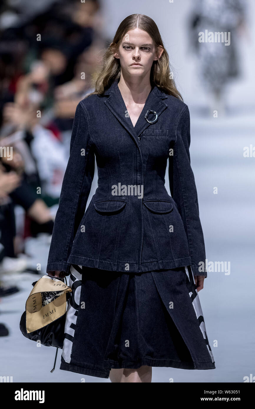 A model displays a new creation at the fashion show of IMMI during the ...