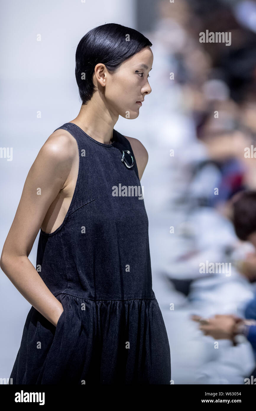 Chinese model Pei Bei displays a new creation at the fashion show of ...