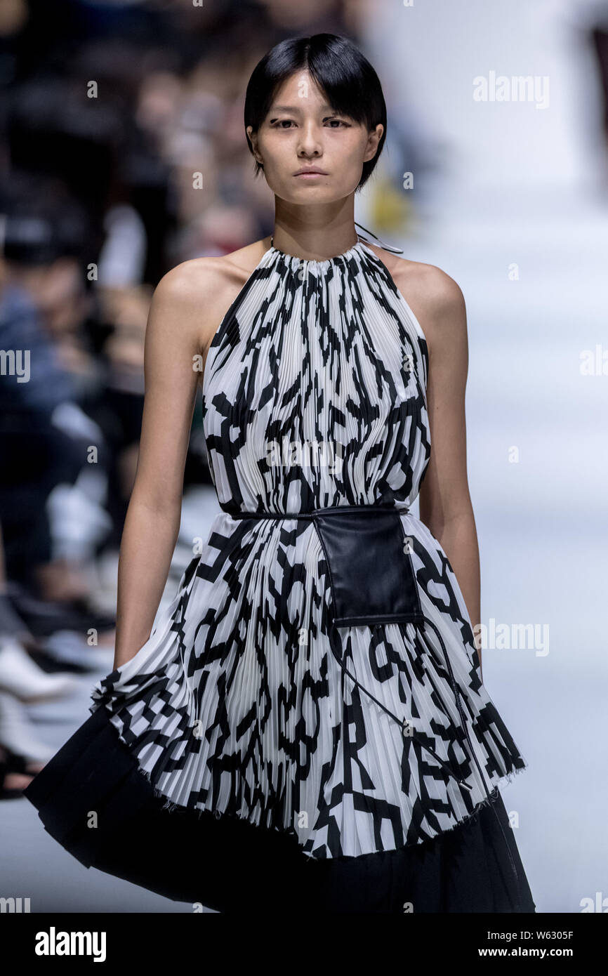 A model displays a new creation at the fashion show of IMMI during the ...