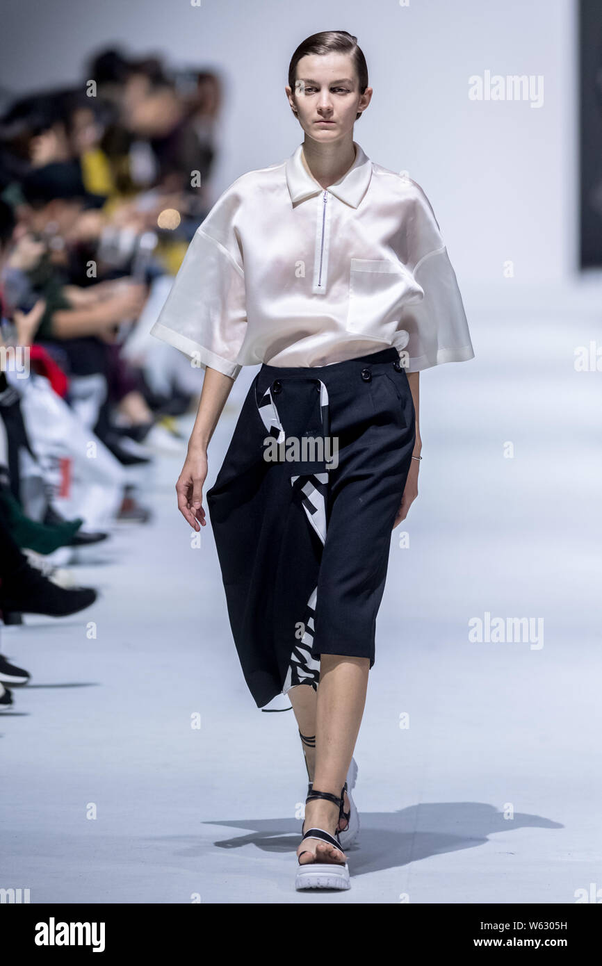 A model displays a new creation at the fashion show of IMMI during the ...