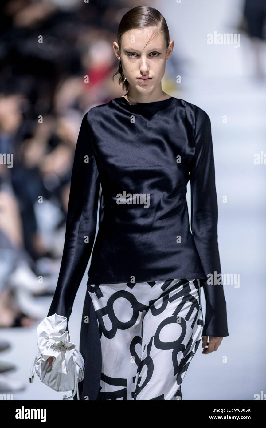 A model displays a new creation at the fashion show of IMMI during the ...