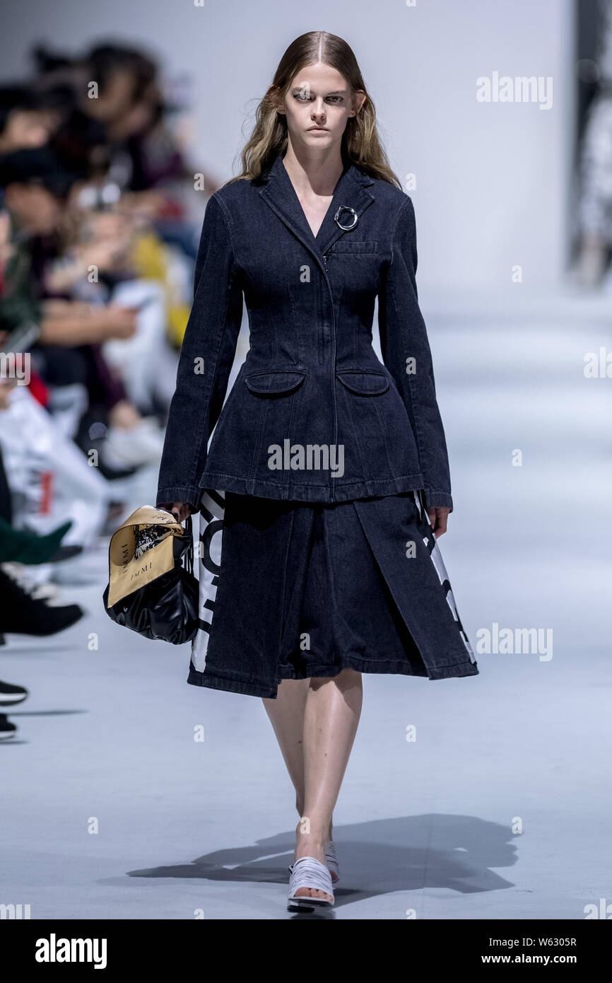 A model displays a new creation at the fashion show of IMMI during the ...
