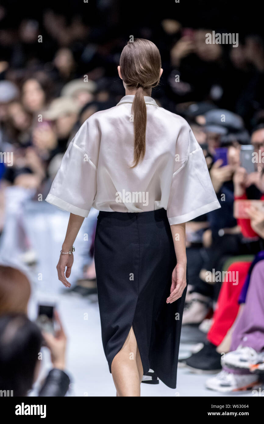 A model displays a new creation at the fashion show of IMMI during the ...