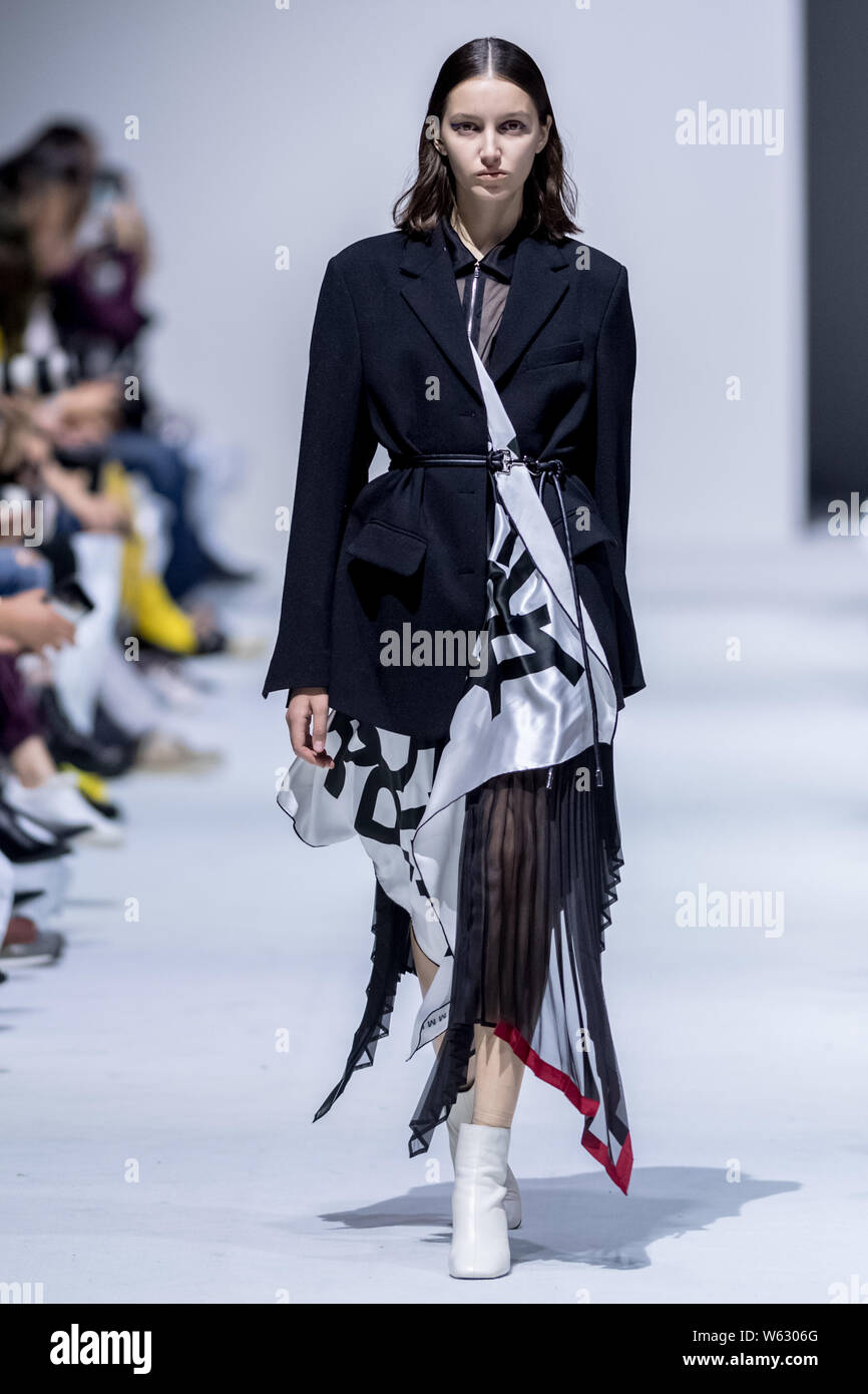 A model displays a new creation at the fashion show of IMMI during the ...