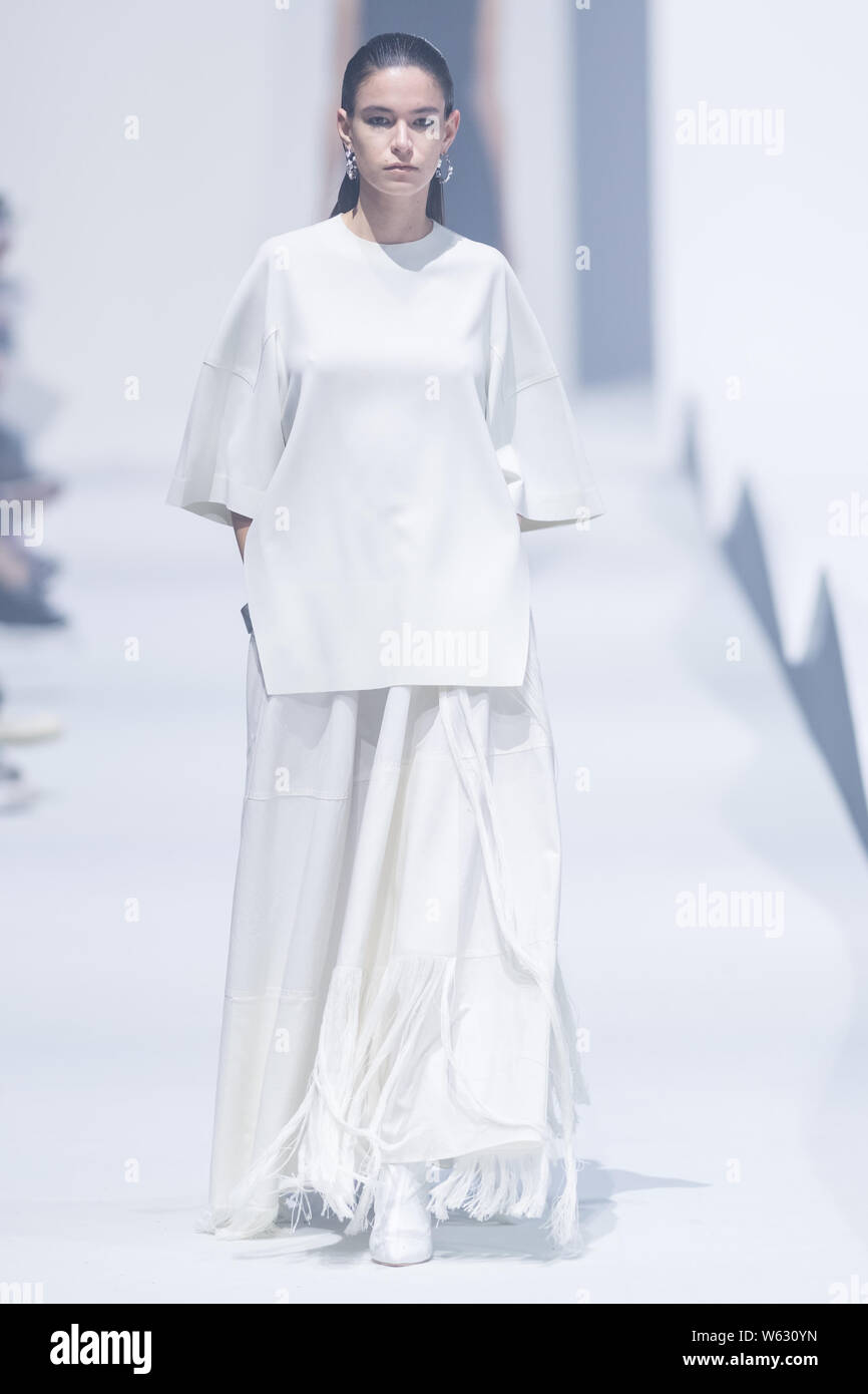 A model displays a new creation at the fashion show of IMM during the ...