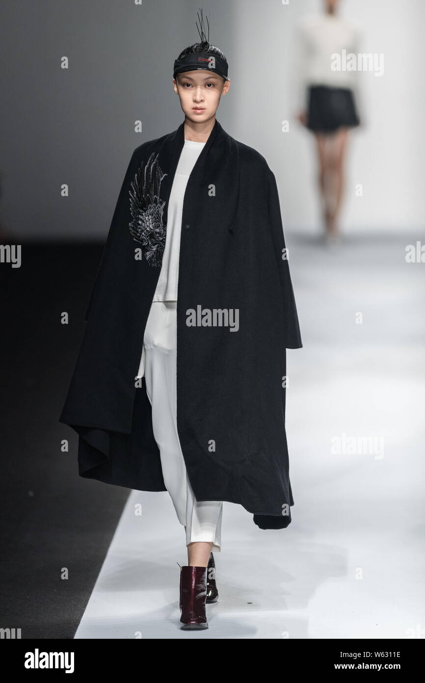 A model displays a new creation at the fashion show of Ji Cheng during ...