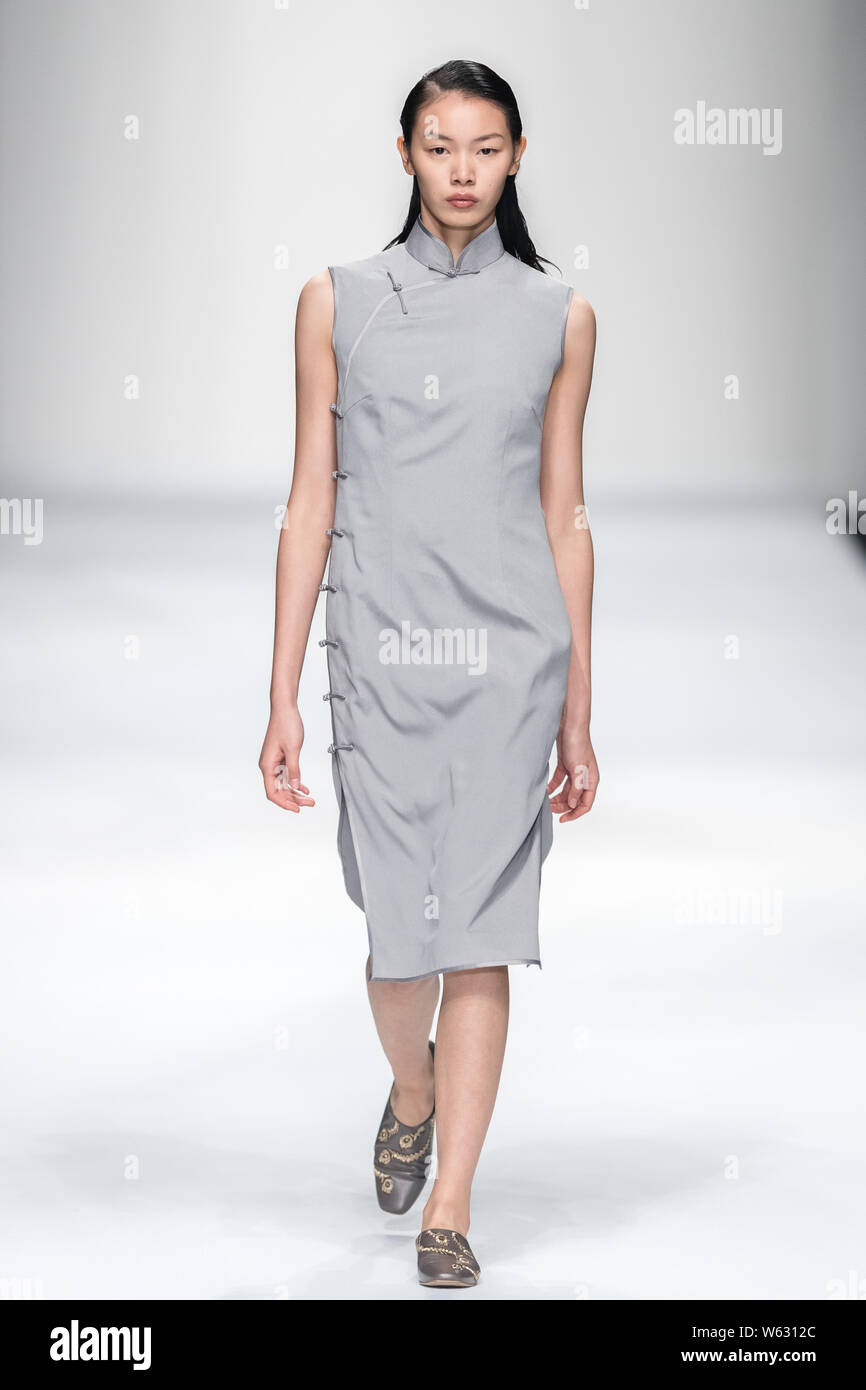 A model displays a new creation at the fashion show of Ji Cheng during ...