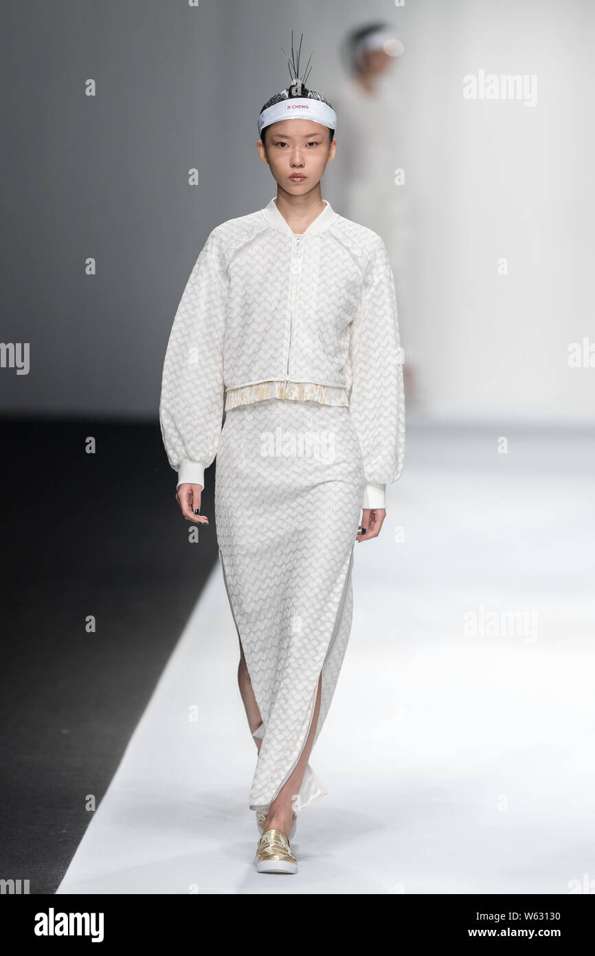 A model displays a new creation at the fashion show of Ji Cheng during ...