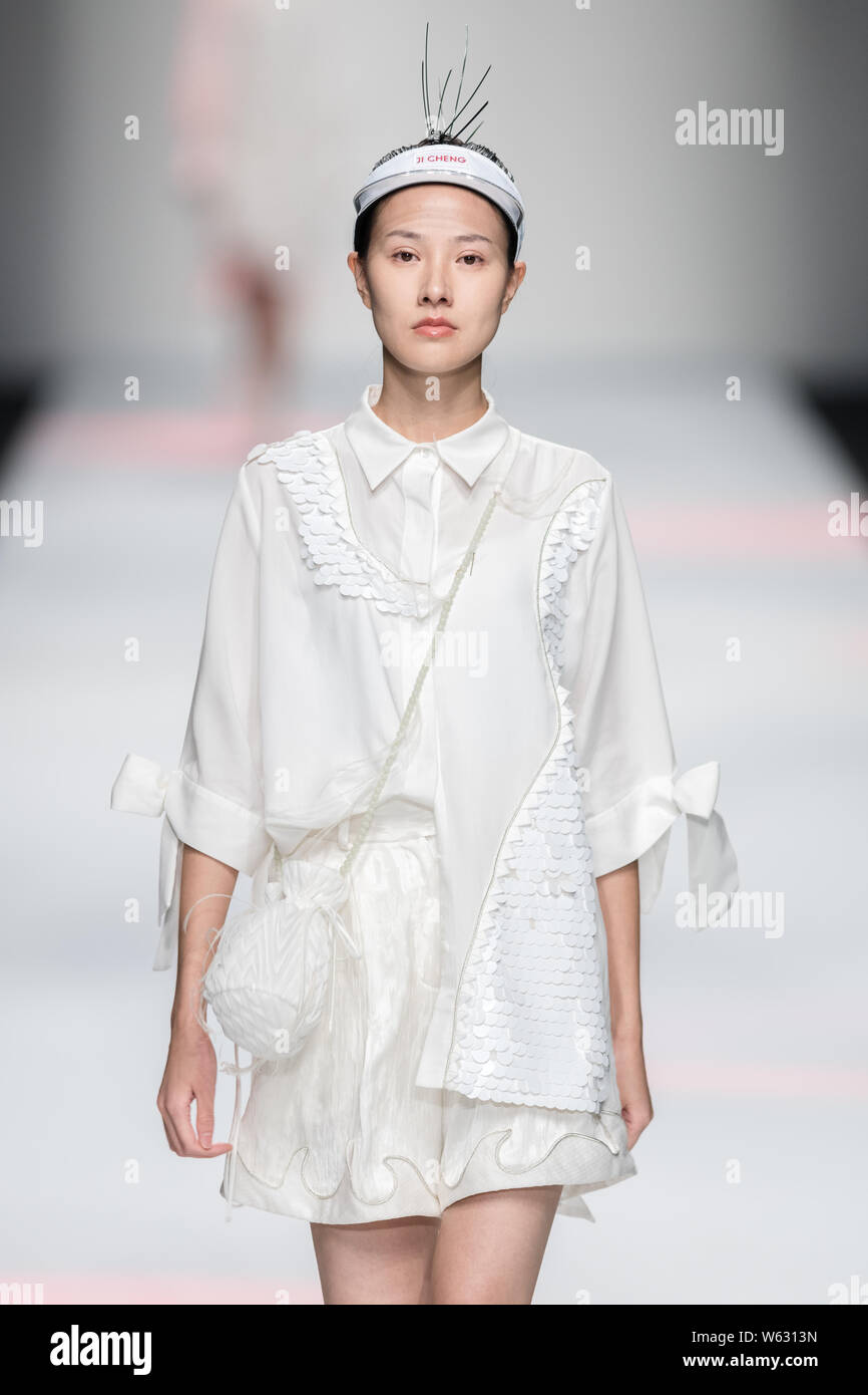 A model displays a new creation at the fashion show of Ji Cheng during ...