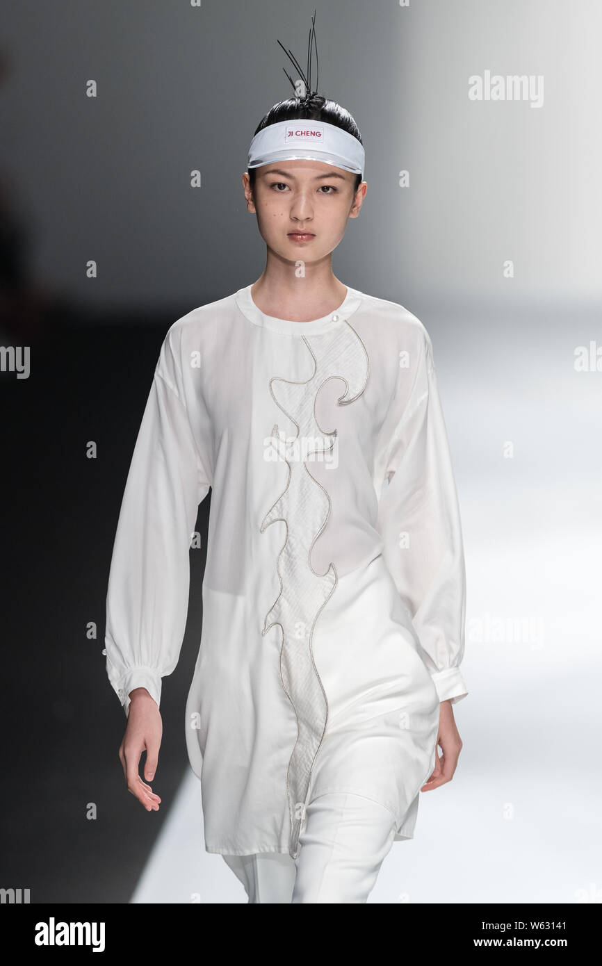 A model displays a new creation at the fashion show of Ji Cheng during ...