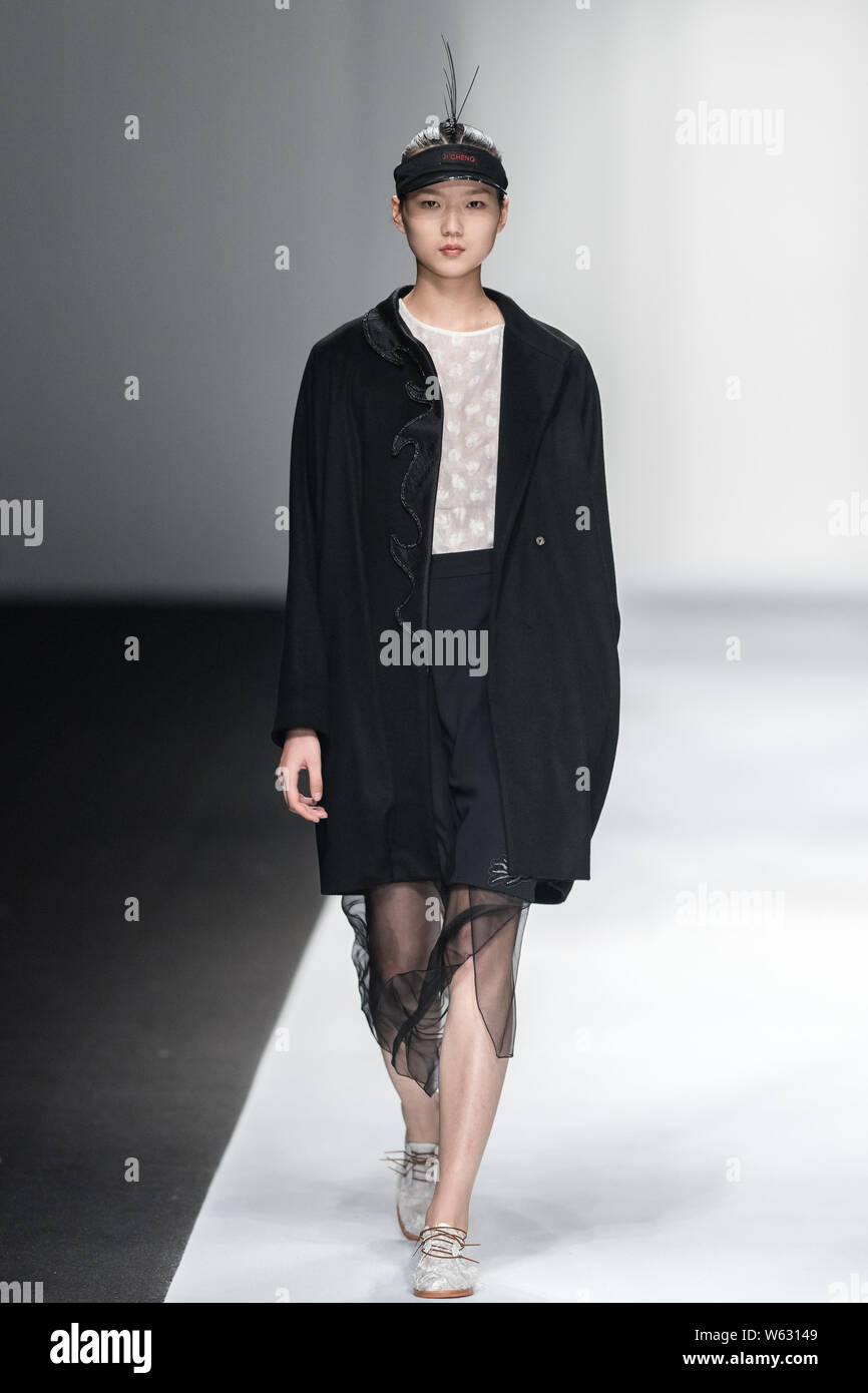 A model displays a new creation at the fashion show of Ji Cheng during ...
