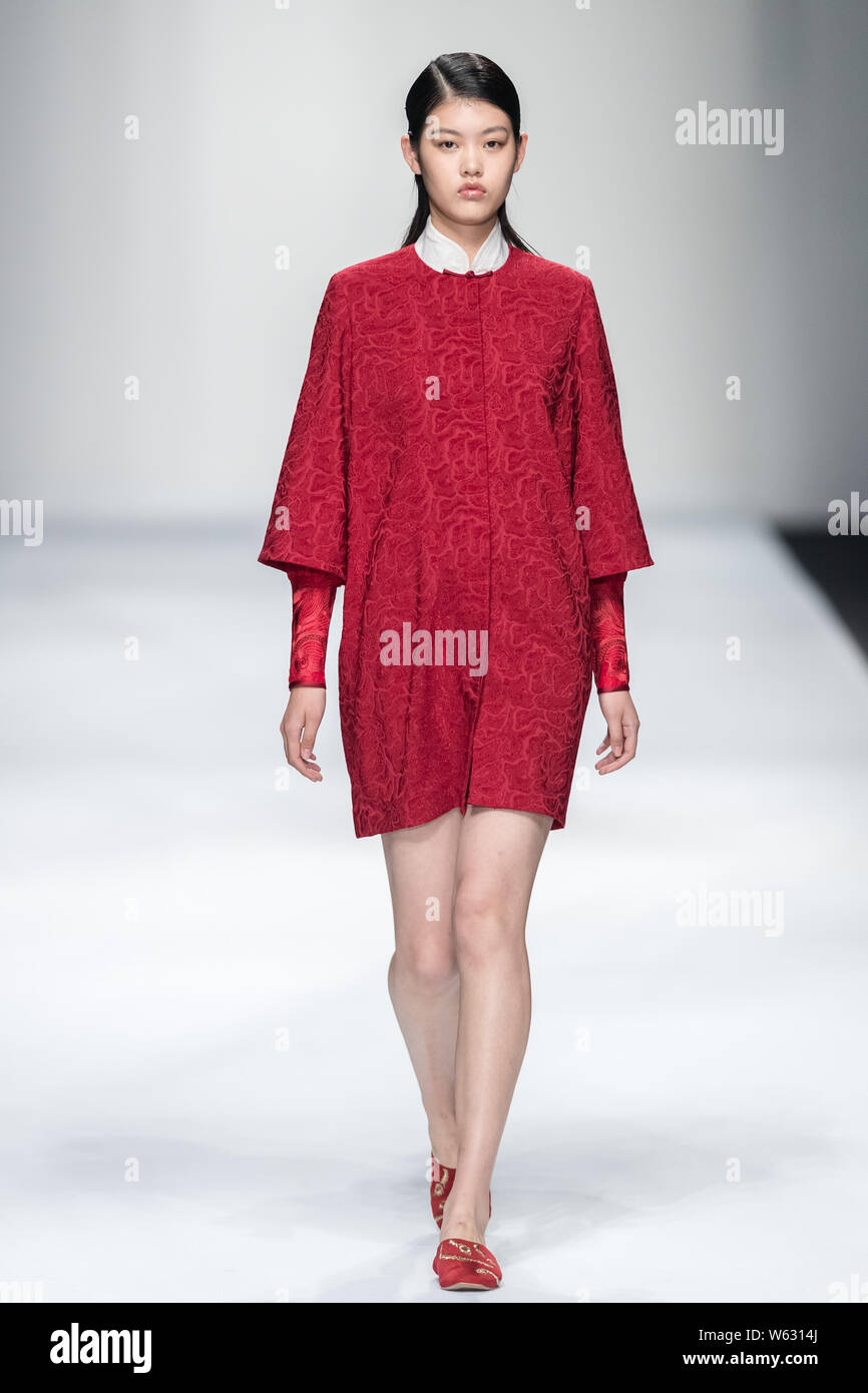 A model displays a new creation at the fashion show of Ji Cheng during ...