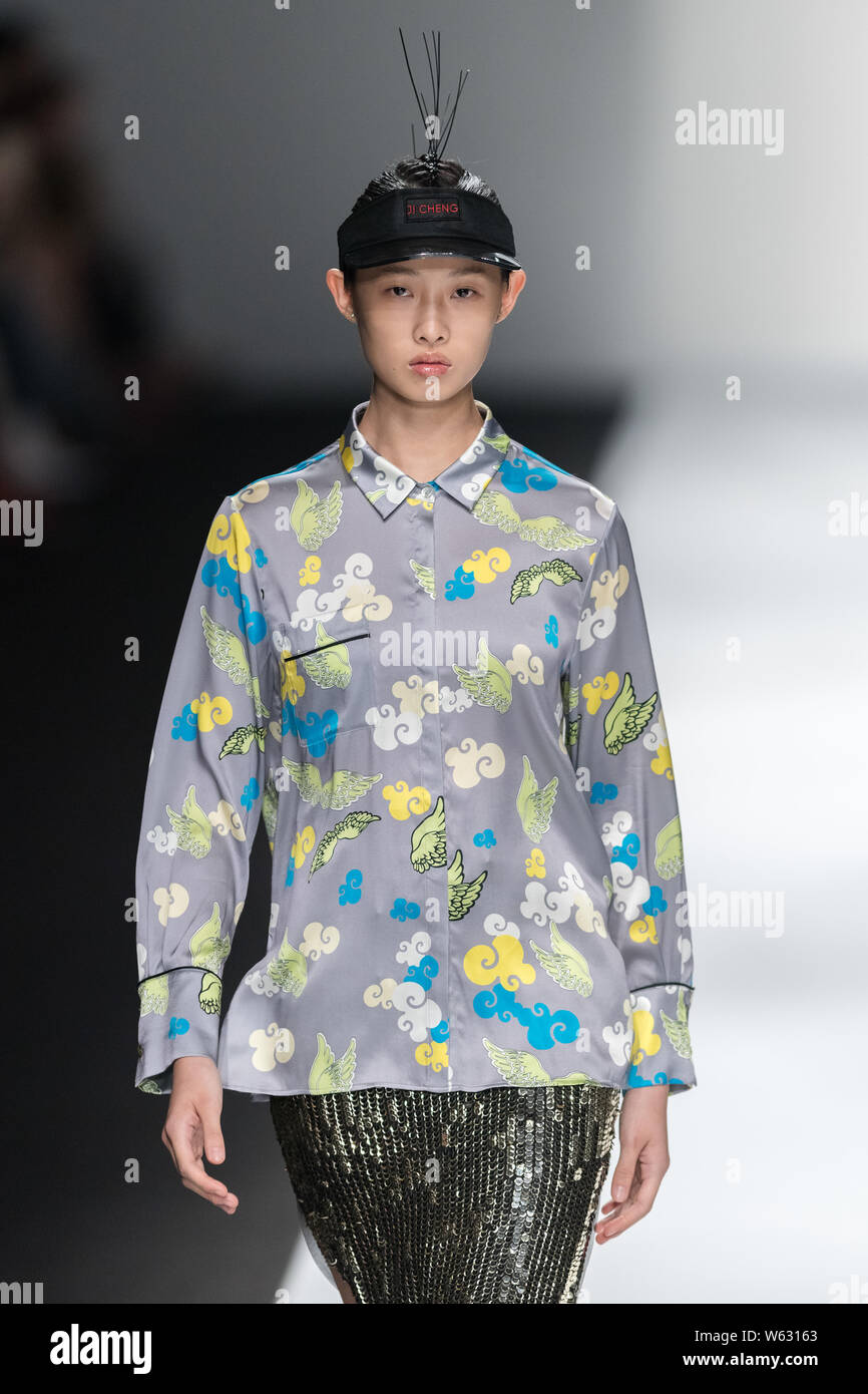 A model displays a new creation at the fashion show of Ji Cheng during ...
