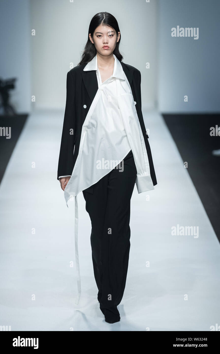 A model displays a new creation at the fashion show of Roderic Wong during the Shanghai Fashion ...