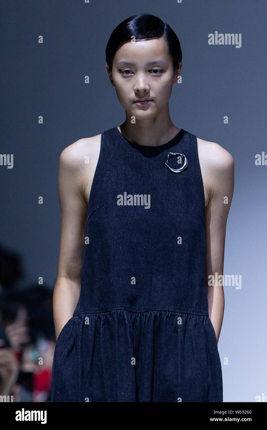 Chinese model Pei Bei displays a new creation at the fashion show of IMMI during the Shanghai ...