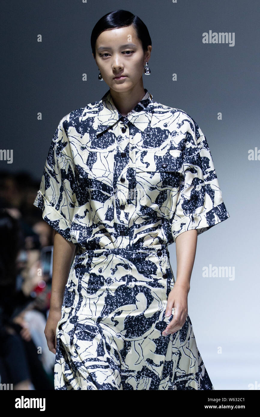 Chinese model Pei Bei displays a new creation at the fashion show of ...