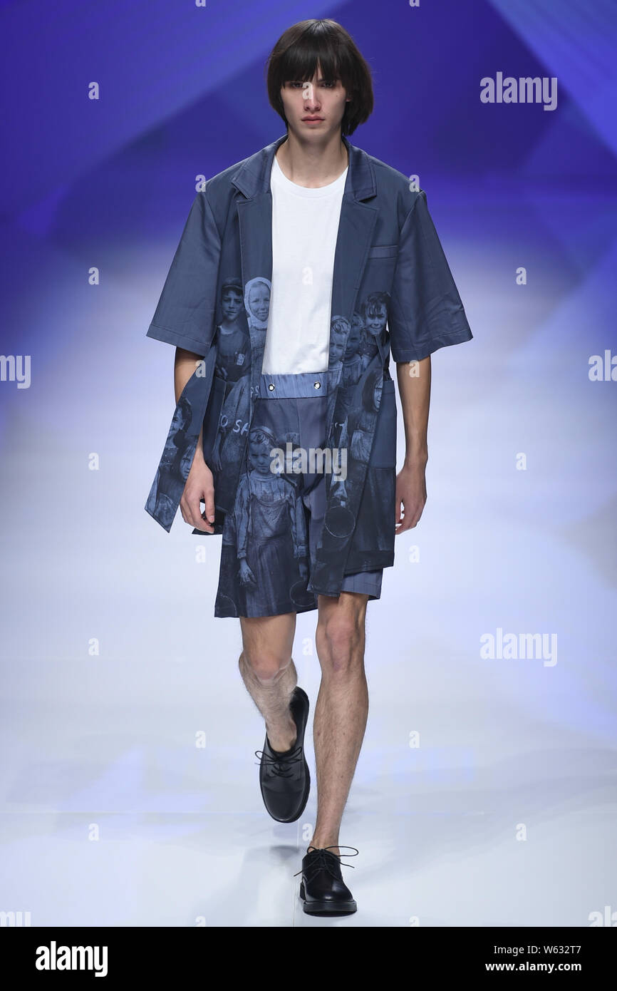 A model displays a new creation at the fashion show of Asahi Kasei ...