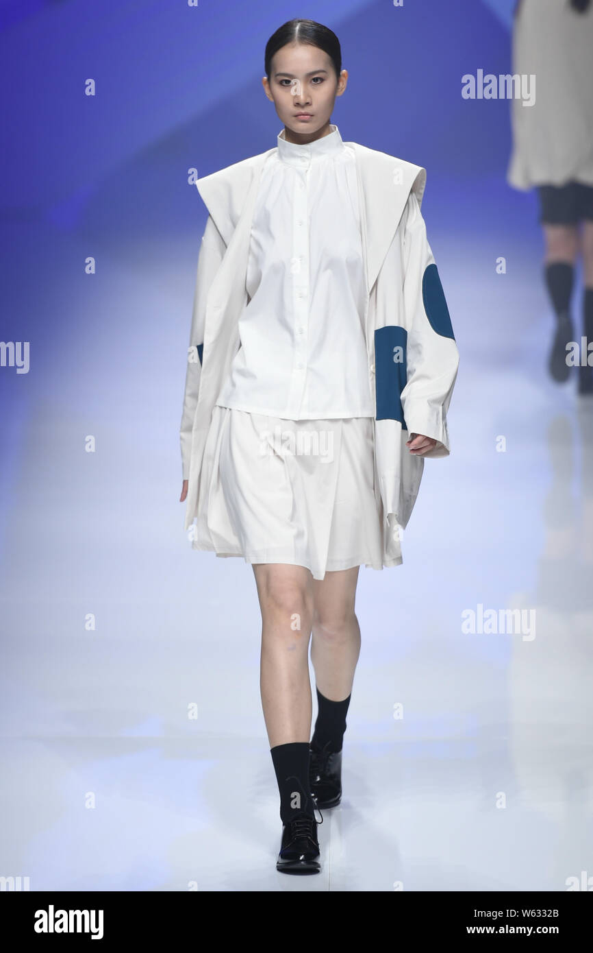 A model displays a new creation at the fashion show of Asahi Kasei ...