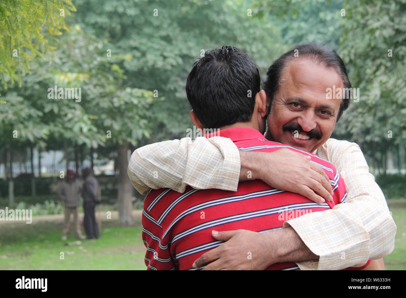 Indian men hugging hi-res stock photography and images - Alamy