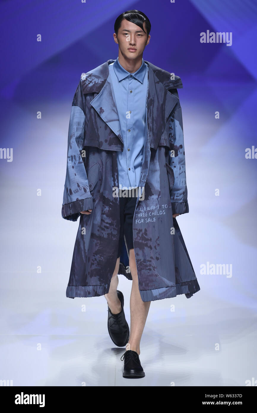 A model displays a new creation at the fashion show of Asahi Kasei ...