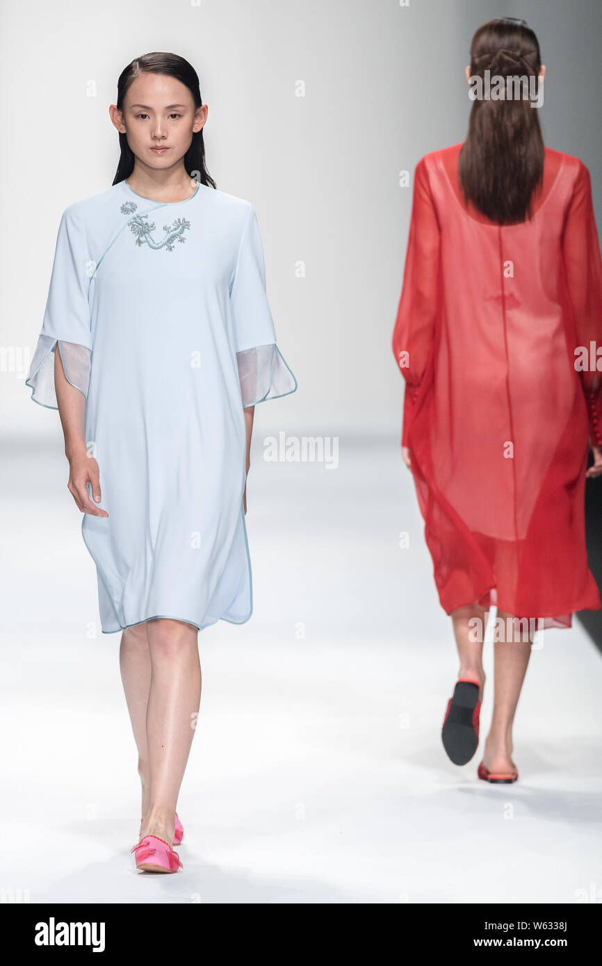A model displays a new creation at the fashion show of Ji Cheng during ...