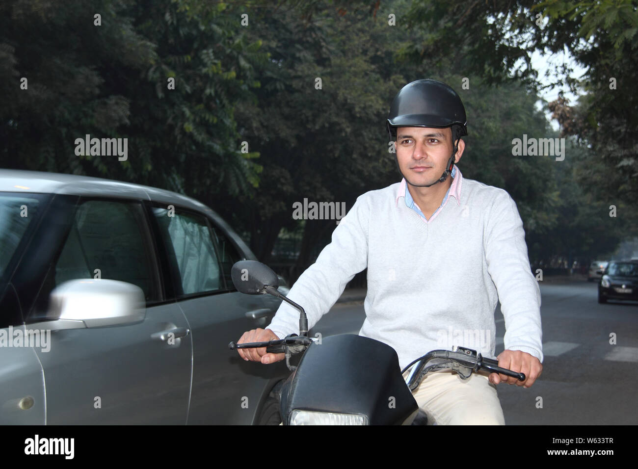 Man riding motorcycle on the road Stock Photo - Alamy