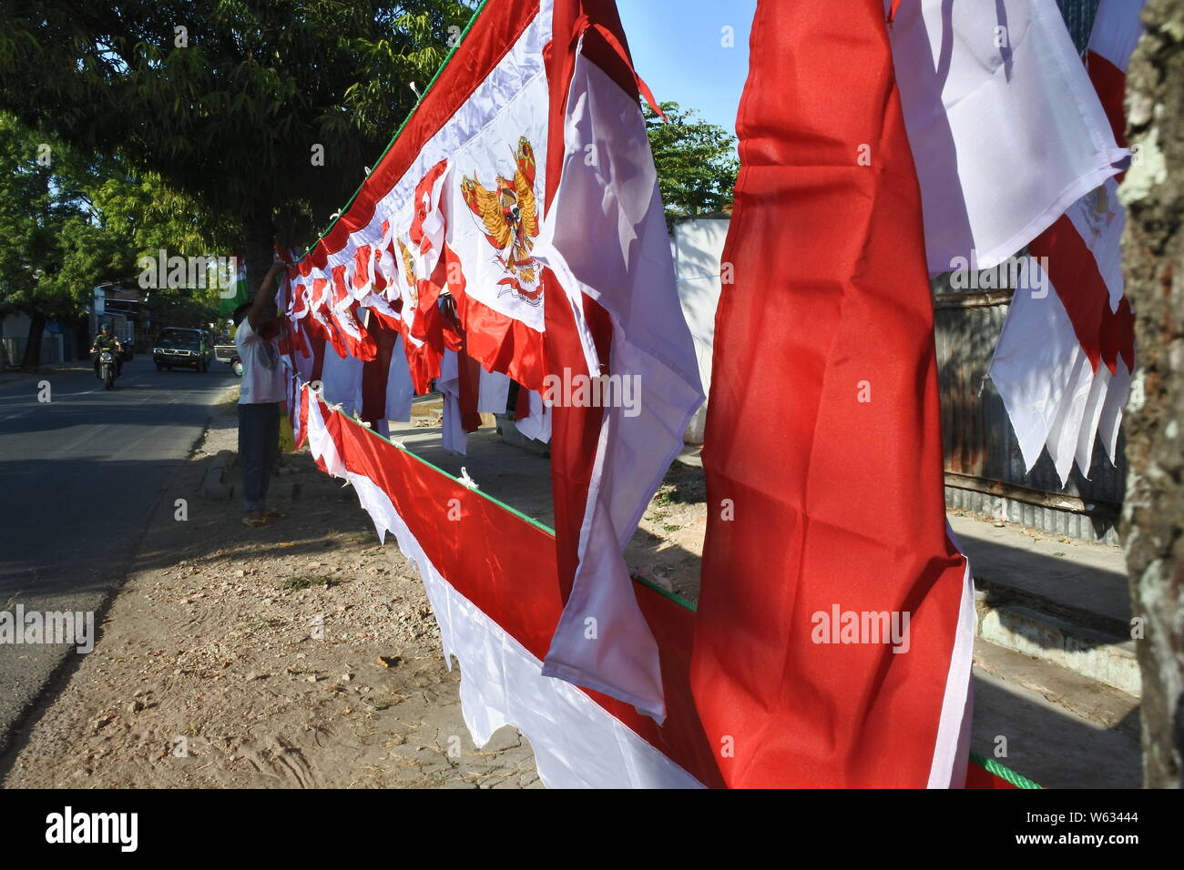 banners and red and white flags on the roadside to enliven the ...