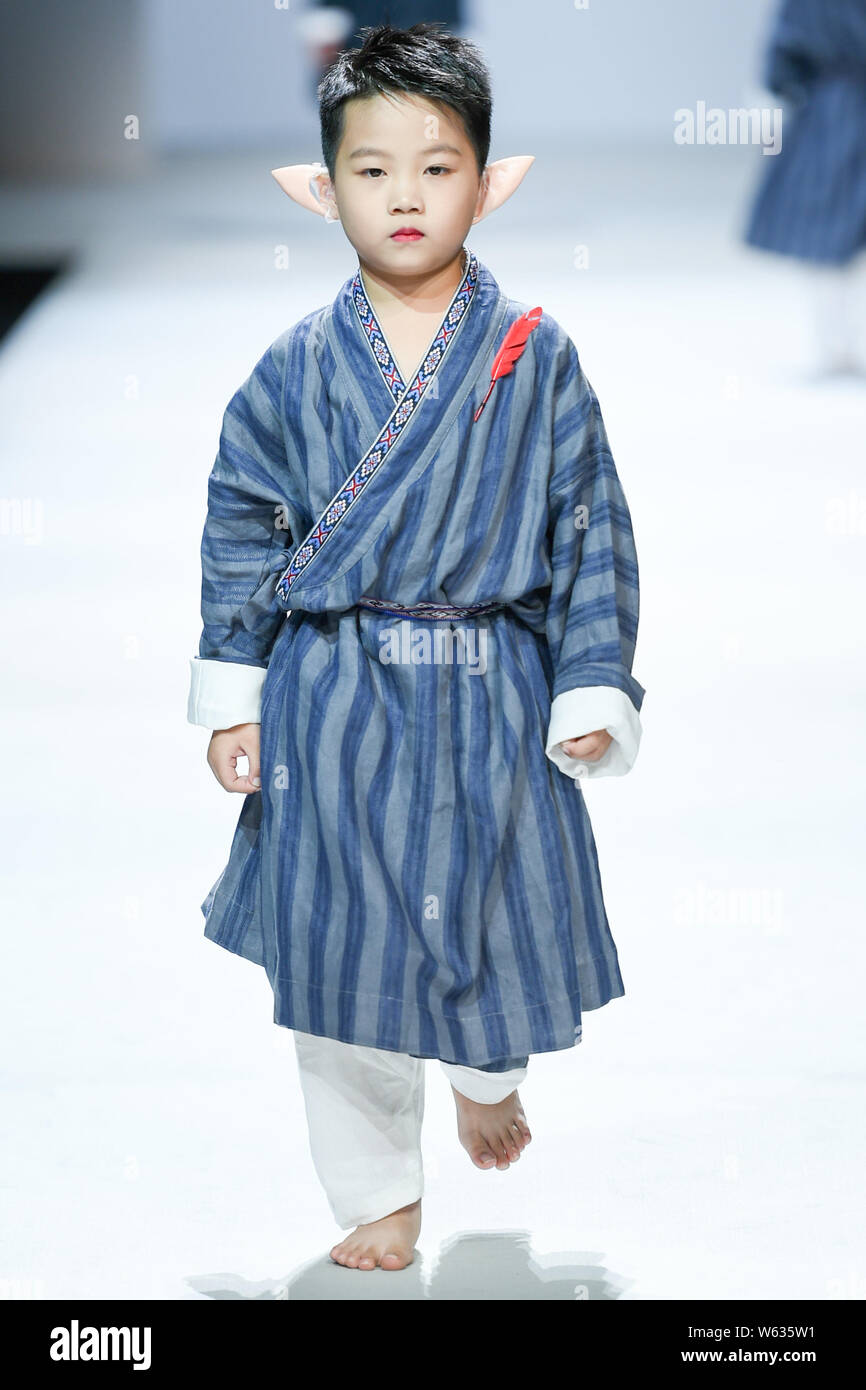 A model displays a new creation at the fashion show of THE YIAN STUDIOS ...