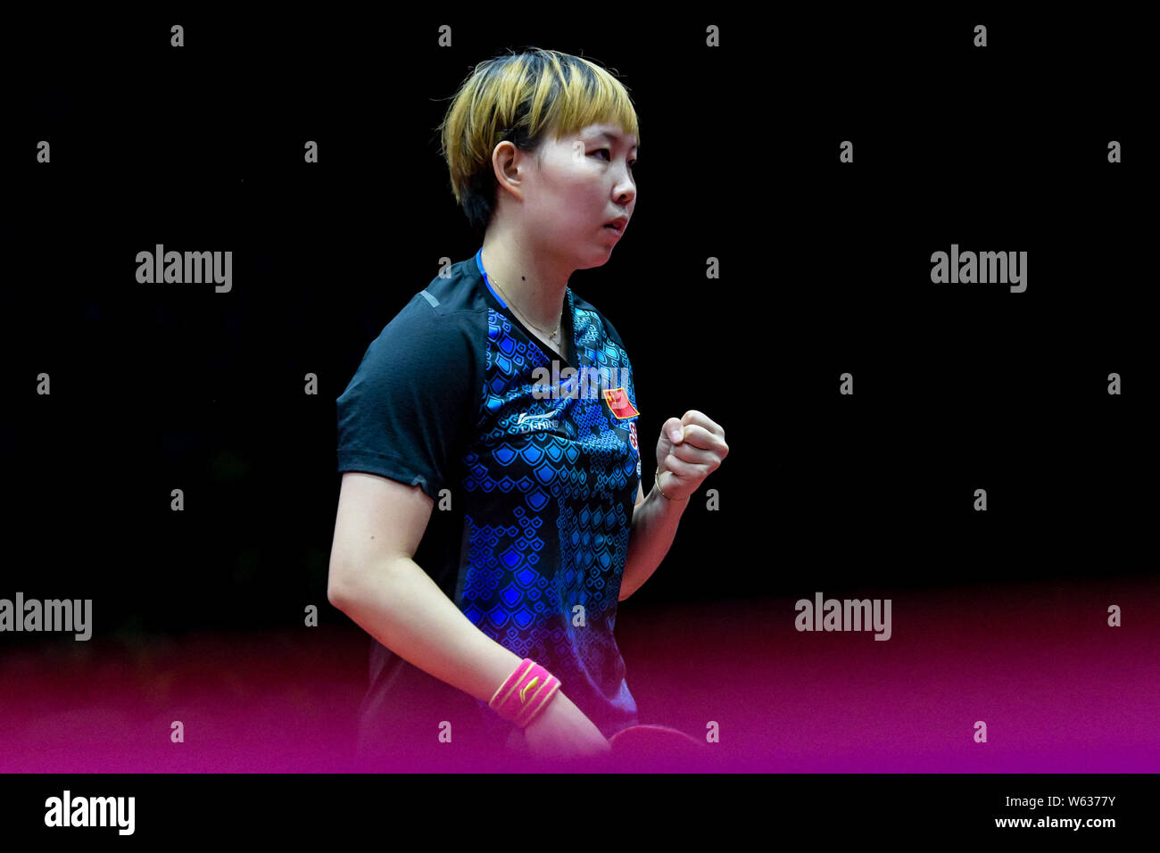 Zhu Yuling of China reacts after scoring against Cheng I-Ching of ...